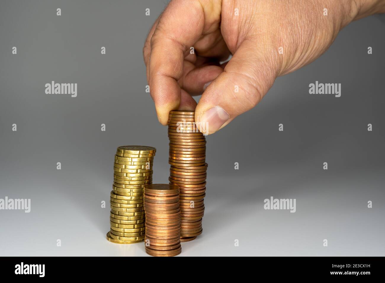 Mans hand put money coins hi-res stock photography and images - Alamy