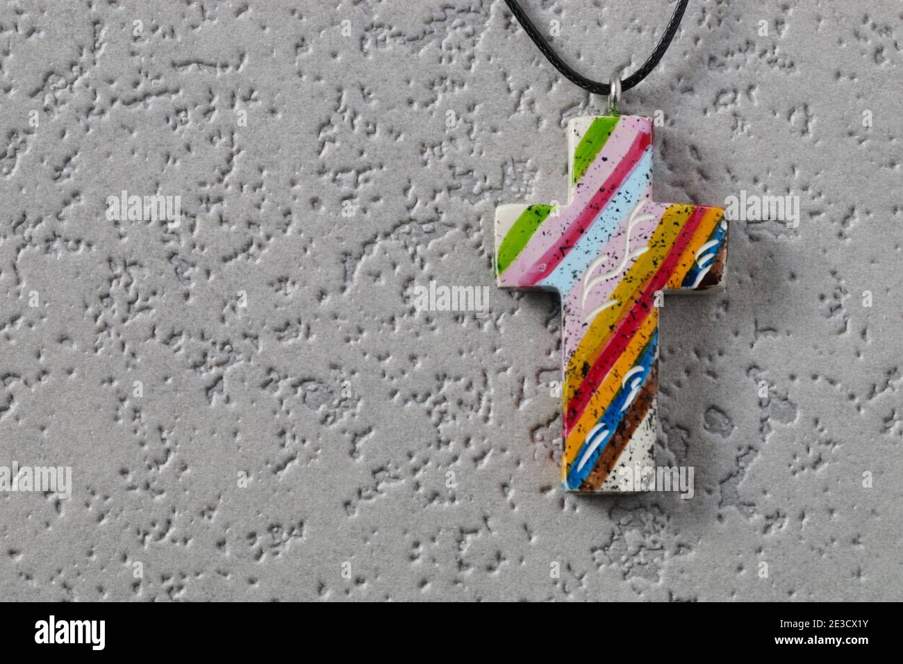Colorful Christian cross on a grey background with copy space Stock ...