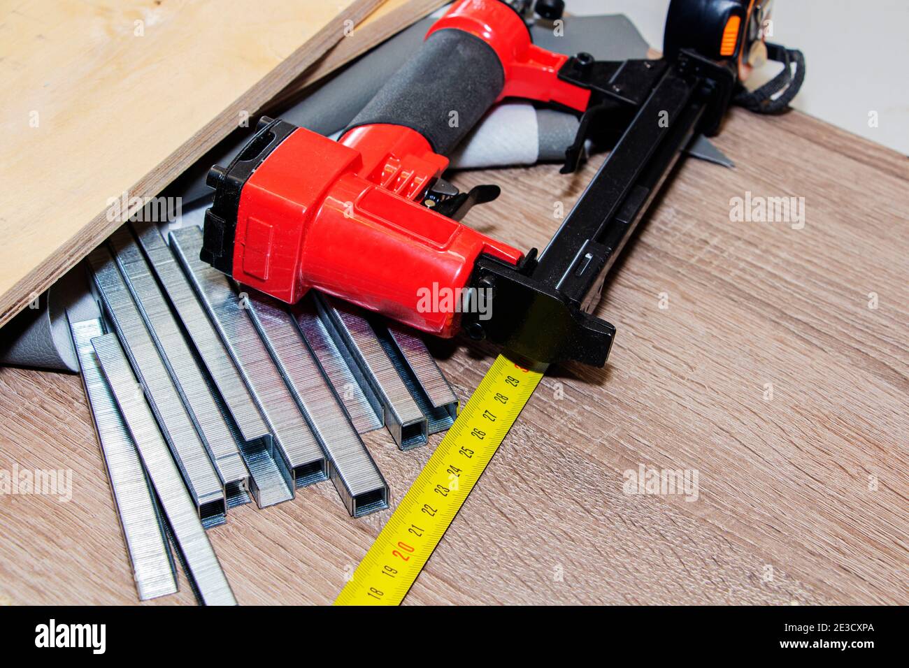 concept of furniture production and repair. Stapler and staples ...