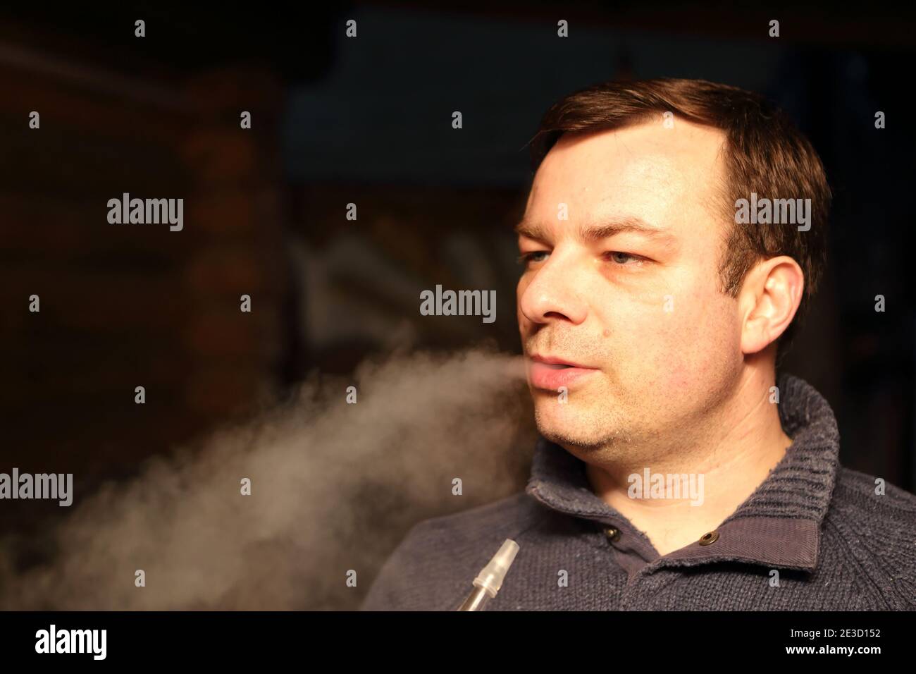 Man smoking shisha in the outdoor cafe Stock Photo - Alamy