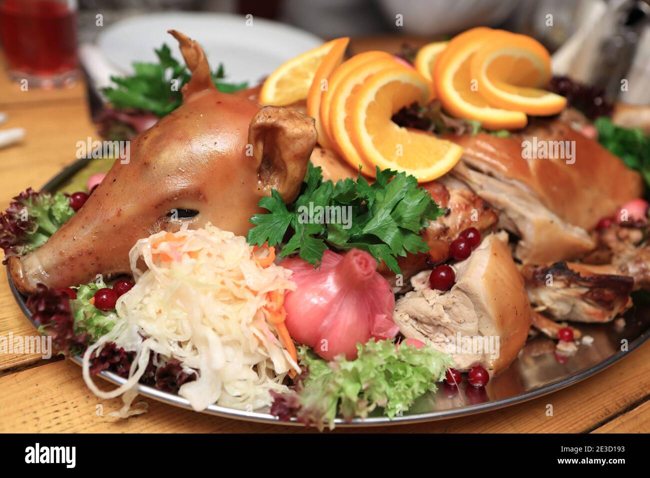 Roasted pig on a plate in restaurant Stock Photo - Alamy