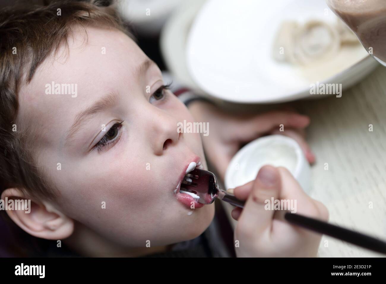 Kid eating meat dumplings in a cafe Stock Photo - Alamy