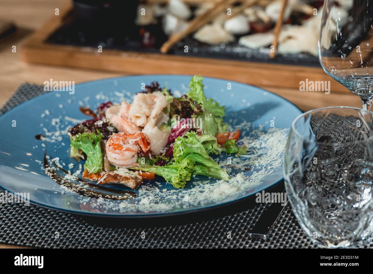 delicious salmon salad with shrimp and egg in a restaurant. small ...