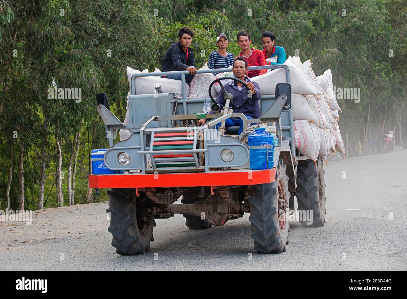 Primitive truck for transporting rice workers and bags of rice in the ...