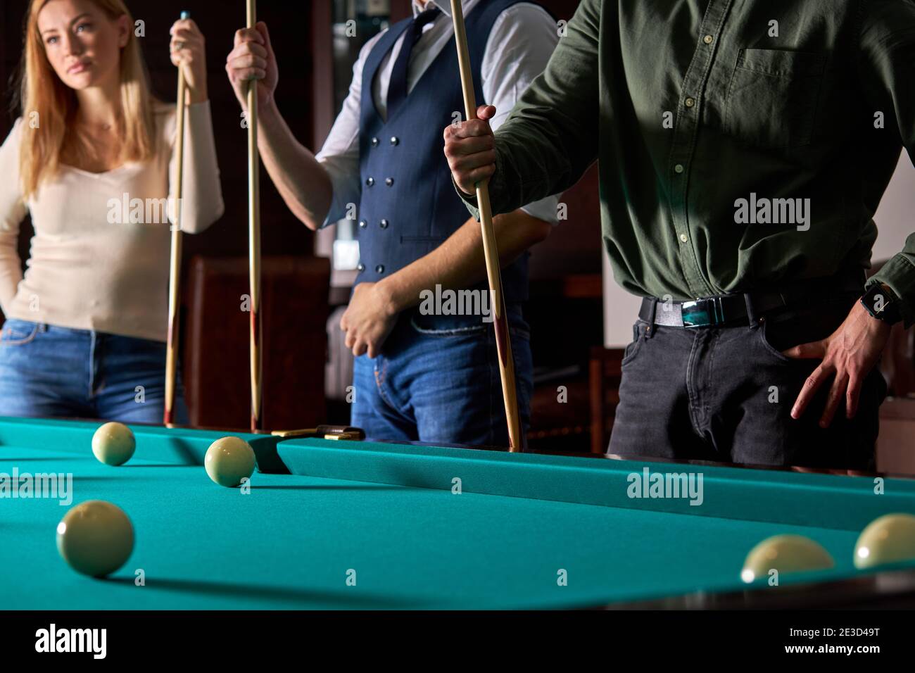 cropped people standing, playing fun billiards, snooker or pool ...