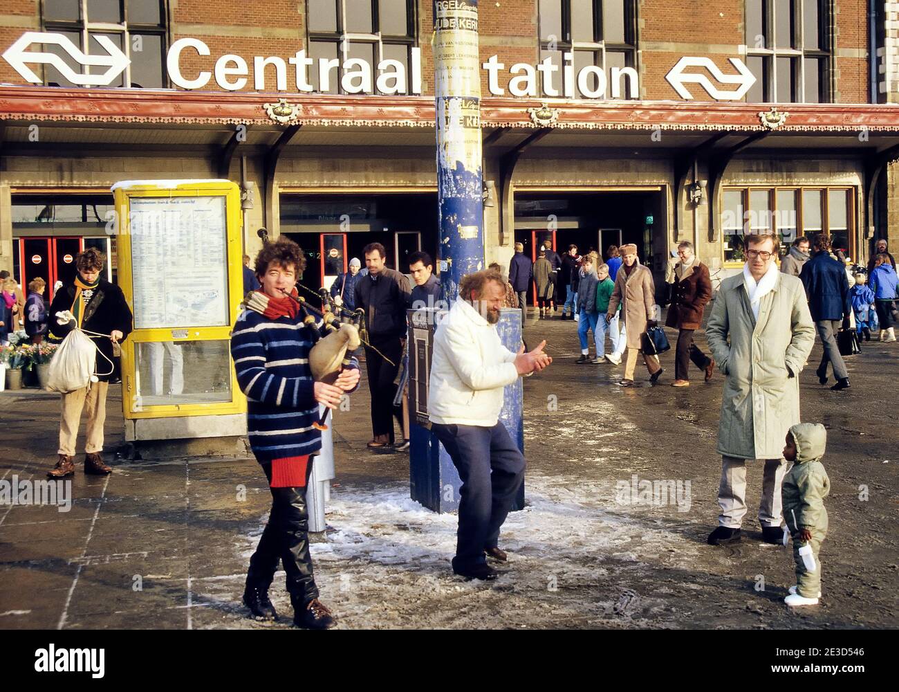 Bag pipe player in front of the Central Station in Amsterdam Stock ...