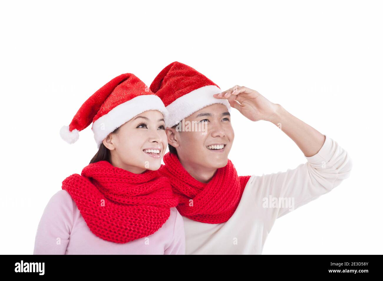 Asian couple wearing santa hat hi-res stock photography and images - Alamy