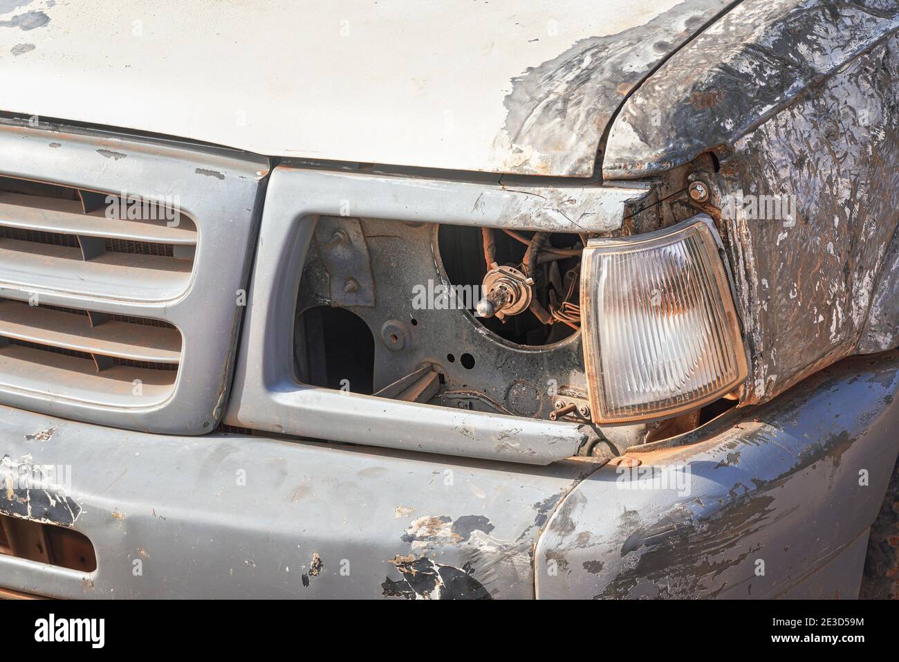 Broken light cover and scratched front paint and metal on SUV all ...