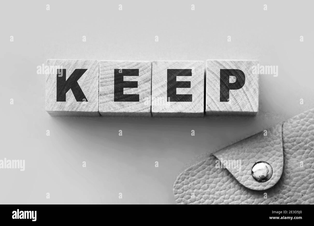 Keep word on wooden blocks and leather wallet. Saving things as they ...