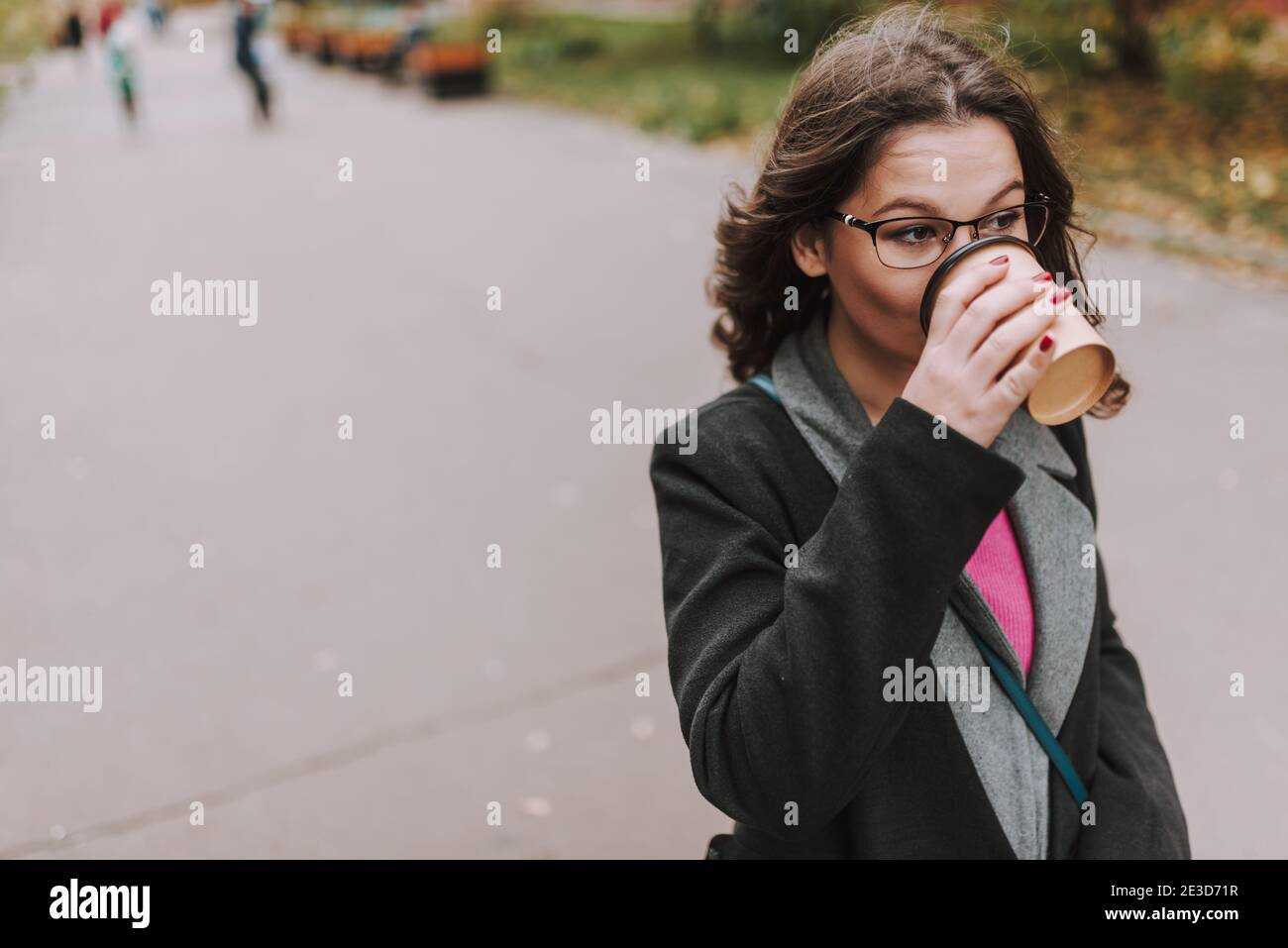 Female student walking into distance hi-res stock photography and ...