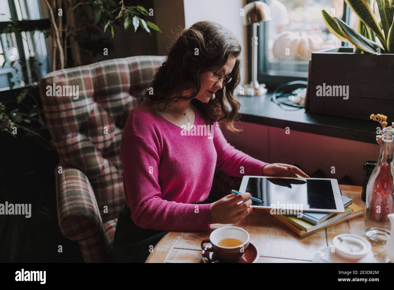 Attractive woman wearing glasses sitting hi-res stock photography and ...