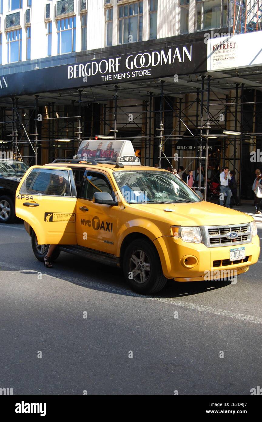Taxi Yellow cab in New York USA Bergdorf Goodman The Mens store open ...