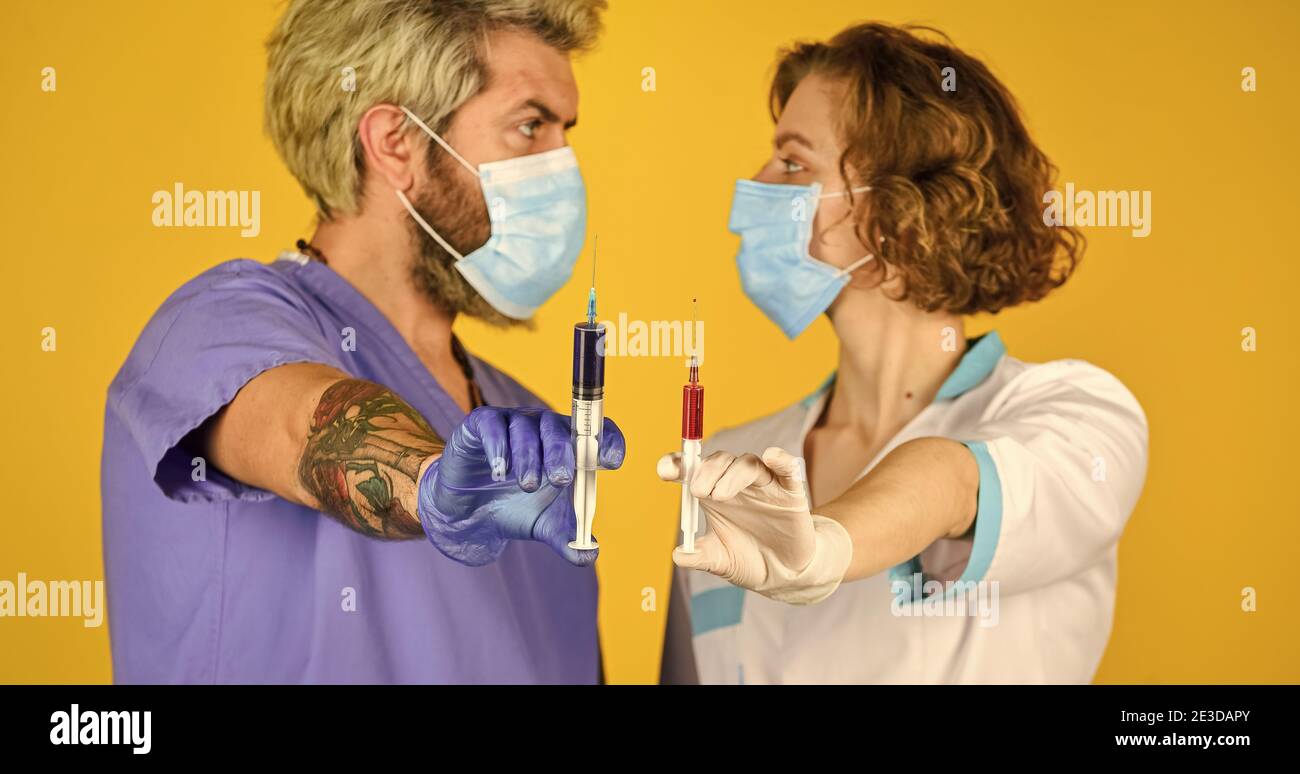 Medical professional working. medical couple use syringe vaccination ...