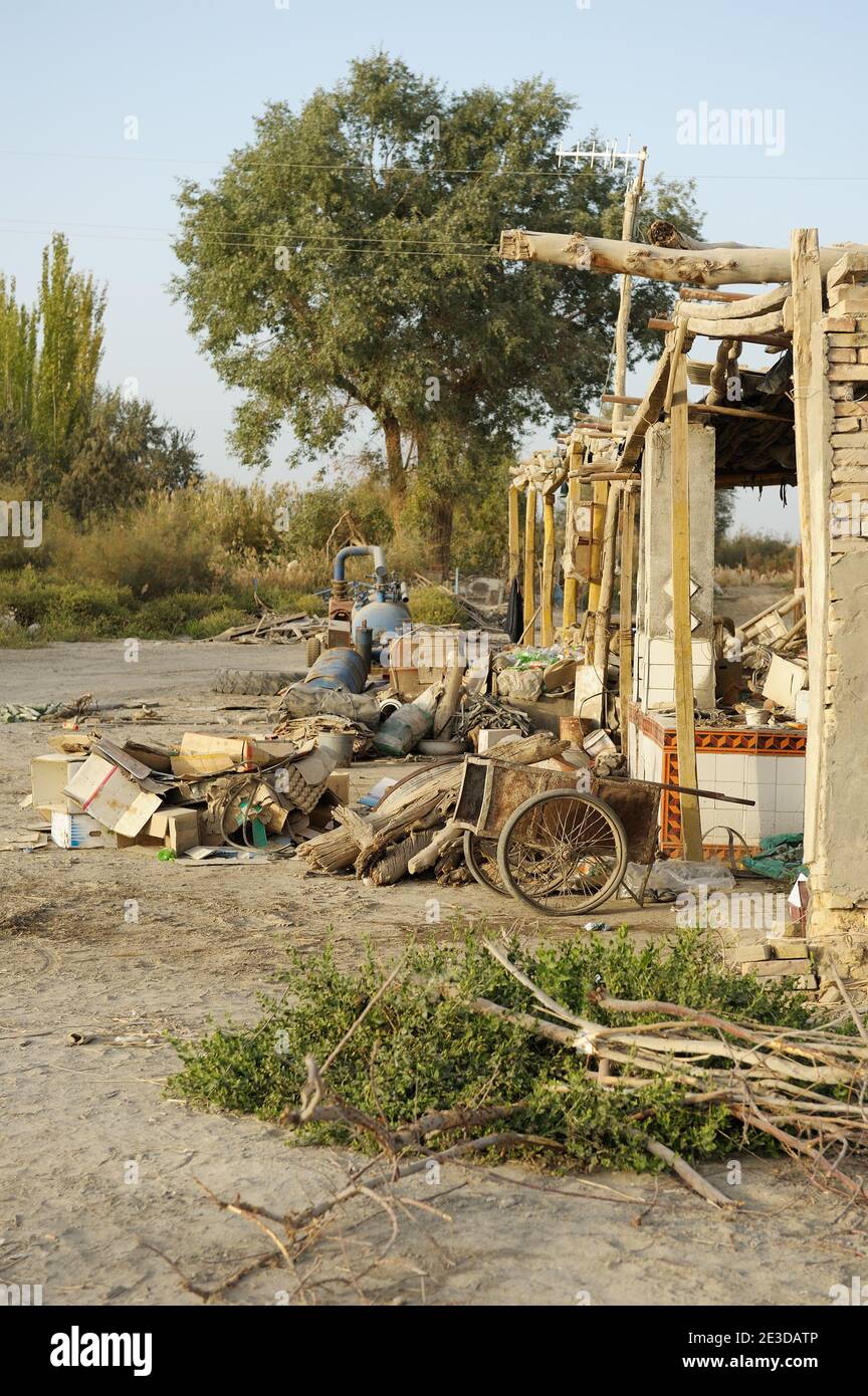 Abandoned objects in front of house, Chinese Xinjiang province Stock ...