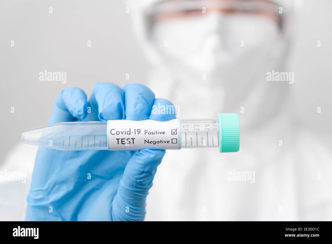 Doctor wearing disposable coverall or protective PPE suit with mask and ...