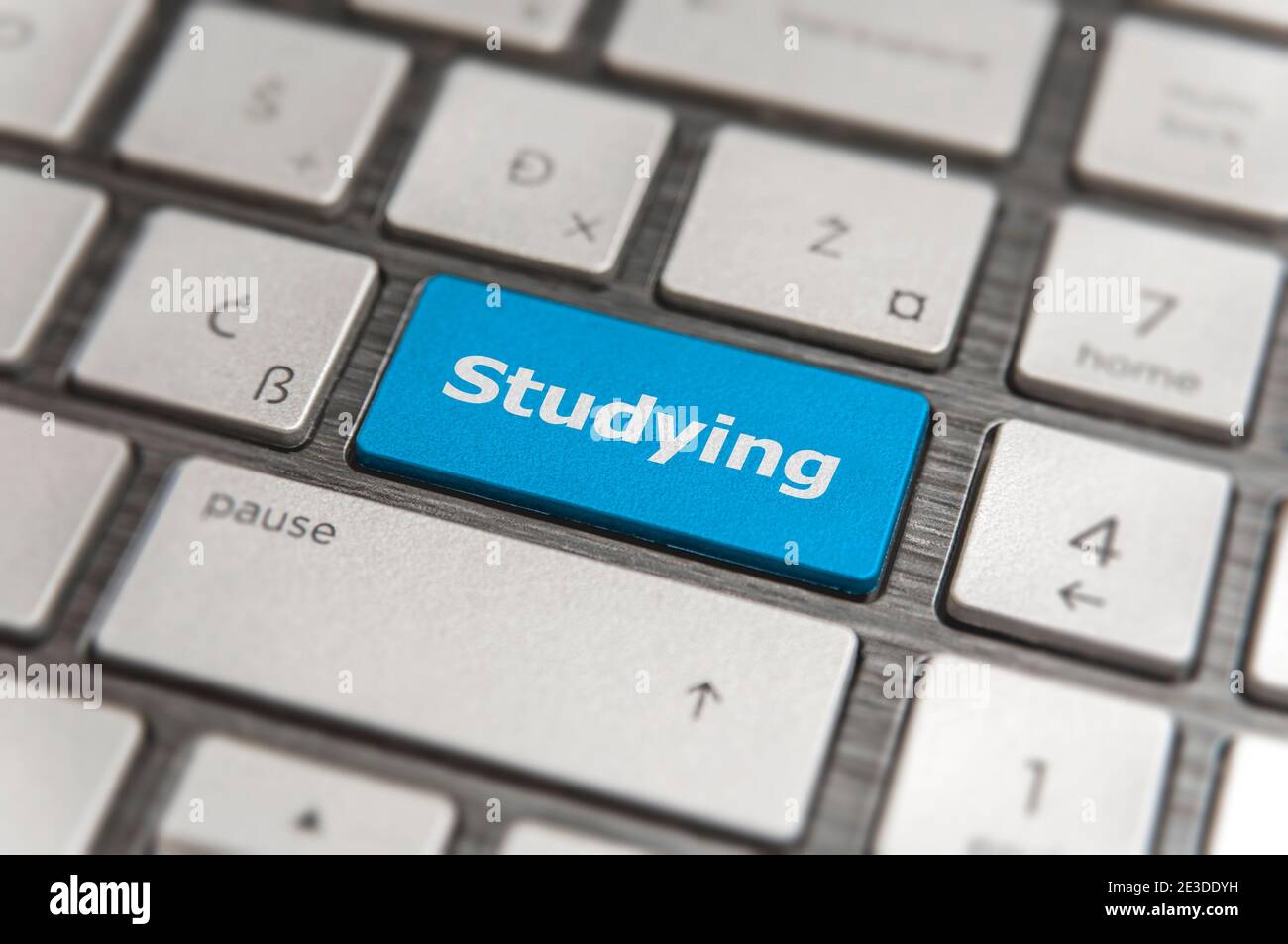 Keyboard with blue key Enter and word Studying button modern pc text ...