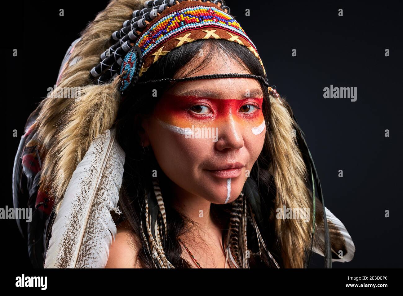 shamanic woman with warrior shaman make up isolated in studio ...