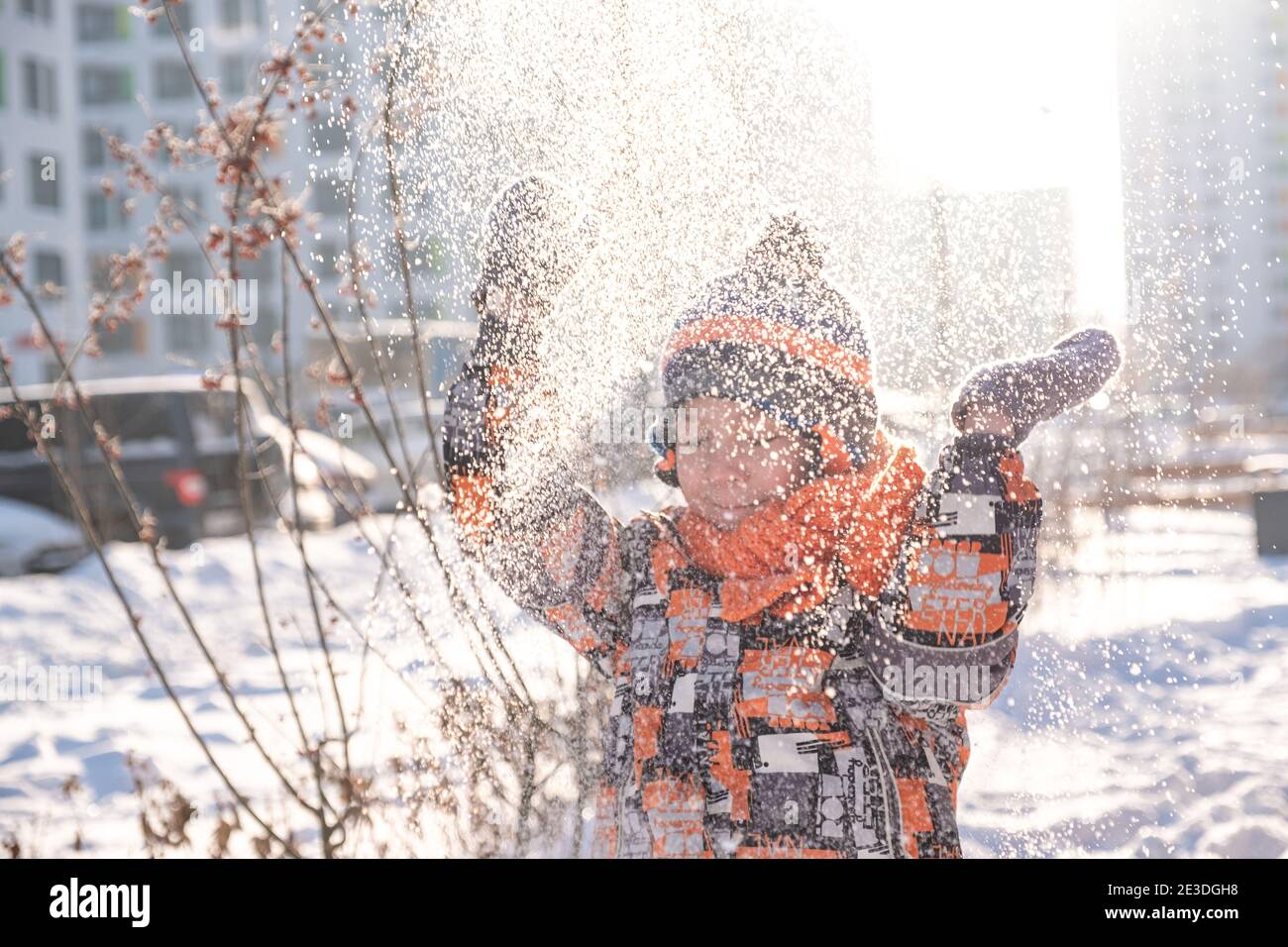 The boy holds snow in hands outdoor Stock Photo - Alamy