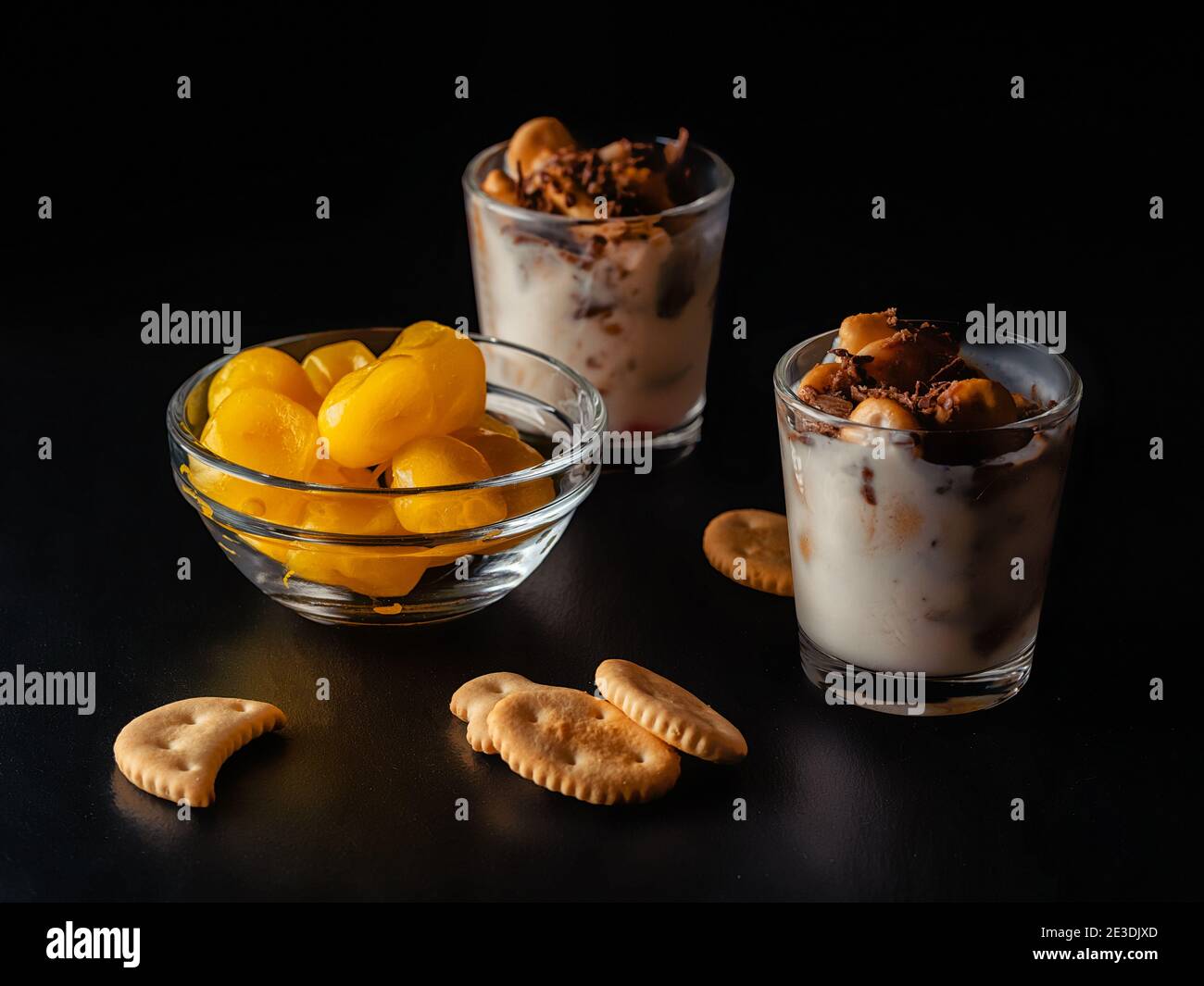 yogurt dessert with toppings on a dark background Stock Photo - Alamy