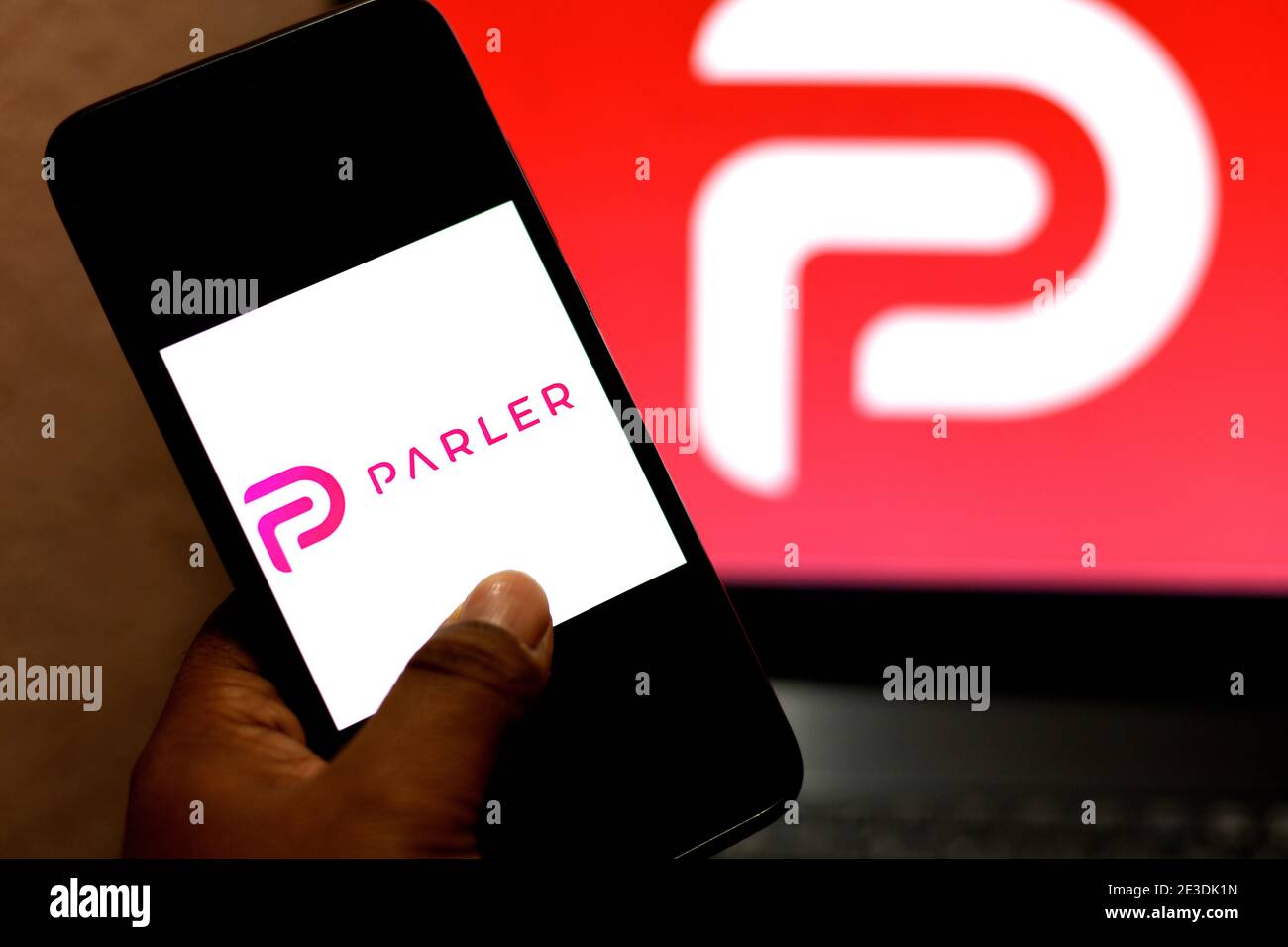 In this photo illustration, a Parler logo seen displayed on a ...