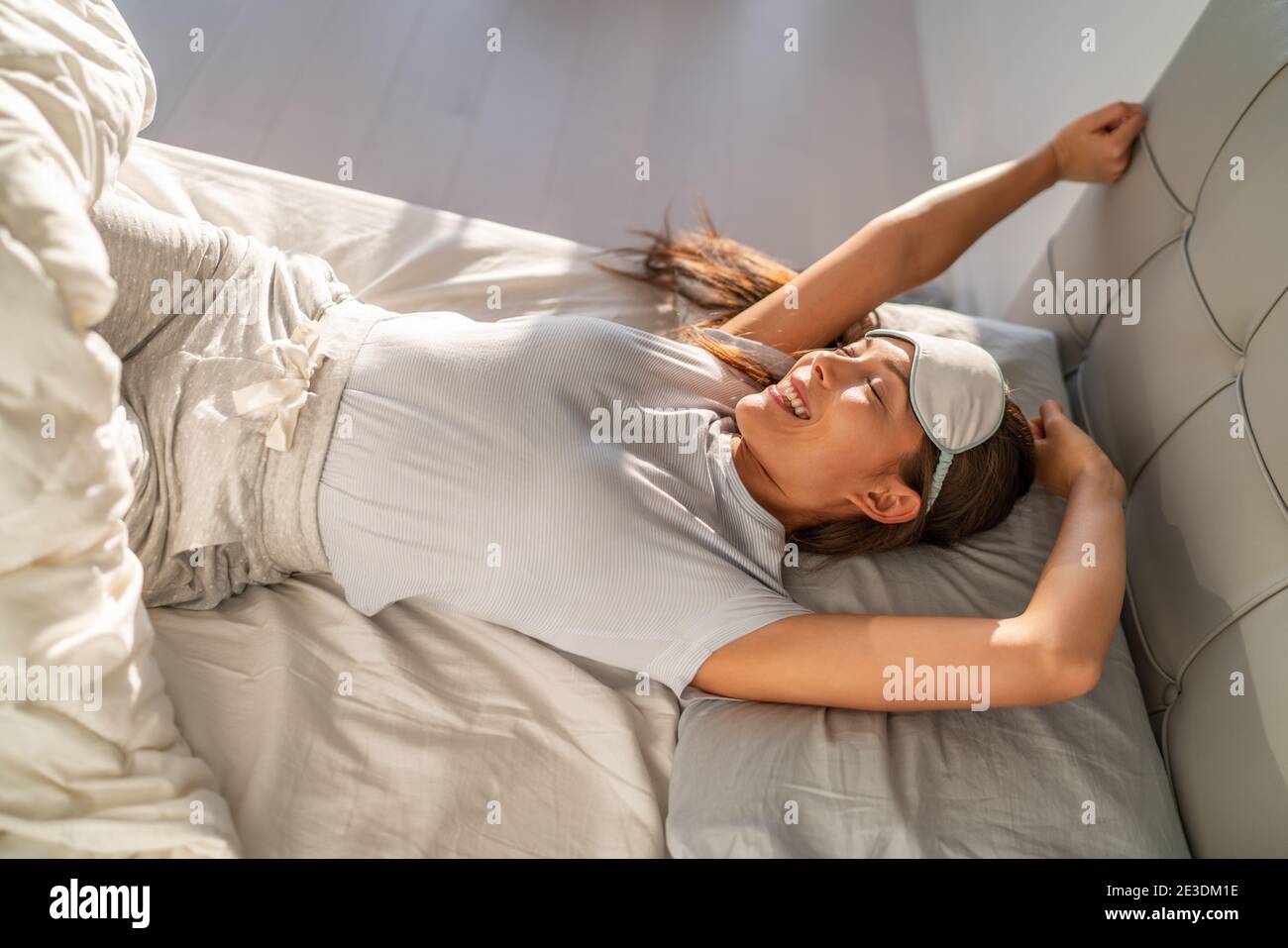 Morning Woman Waking Up Happy Stretching In Bed With Sleeping Eye Mask