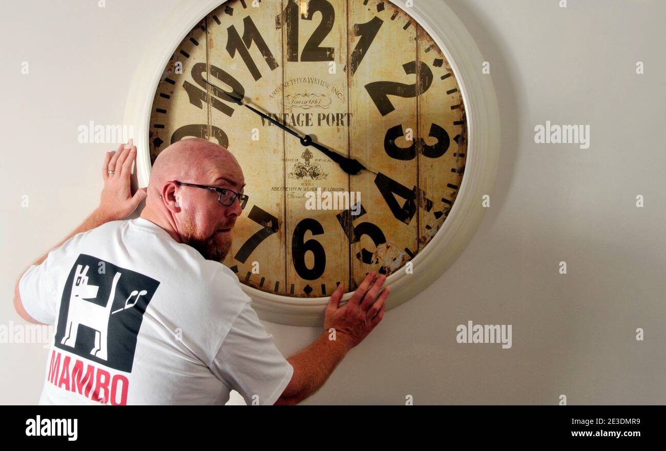 man with big clock Stock Photo - Alamy