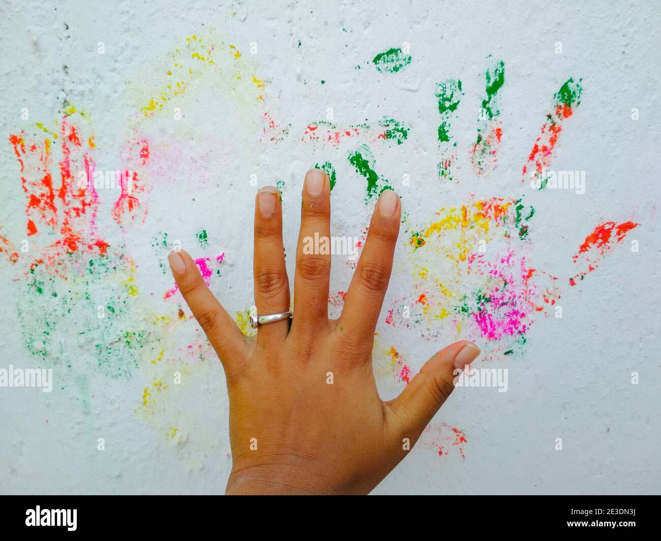 Closeup shot of a human's palm covered in colorful paint Stock Photo ...