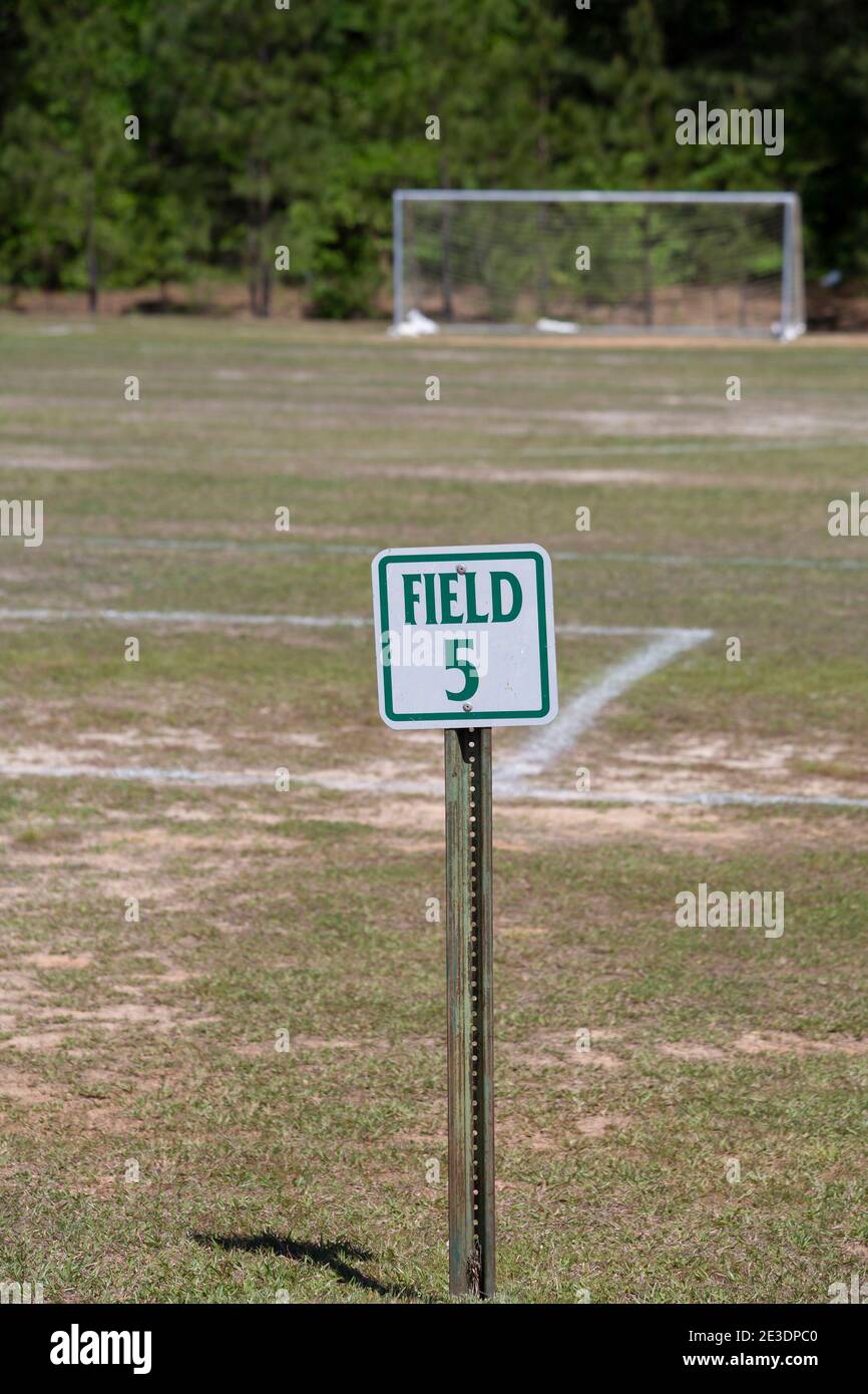 Field number sign with a soccer goal in the background Stock Photo - Alamy