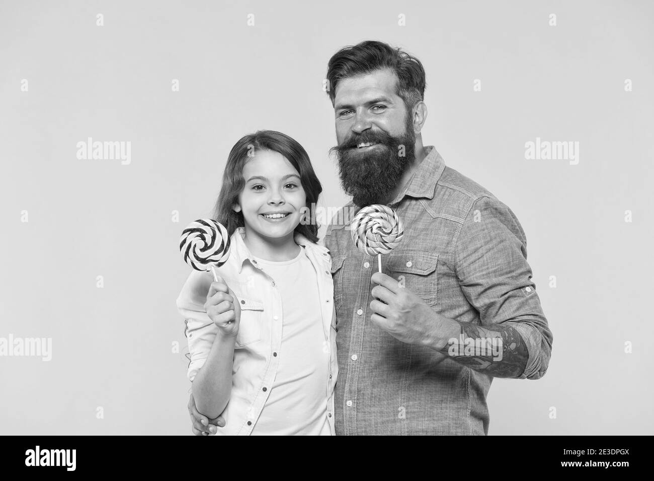 Dessert makes mouths happy. Happy family hold lollipops yellow ...