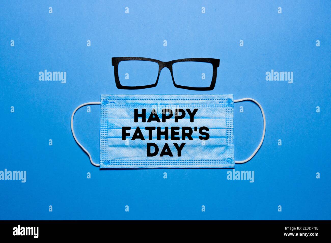 Silhouettes of a man with glasses and a surgical mask with letters ...