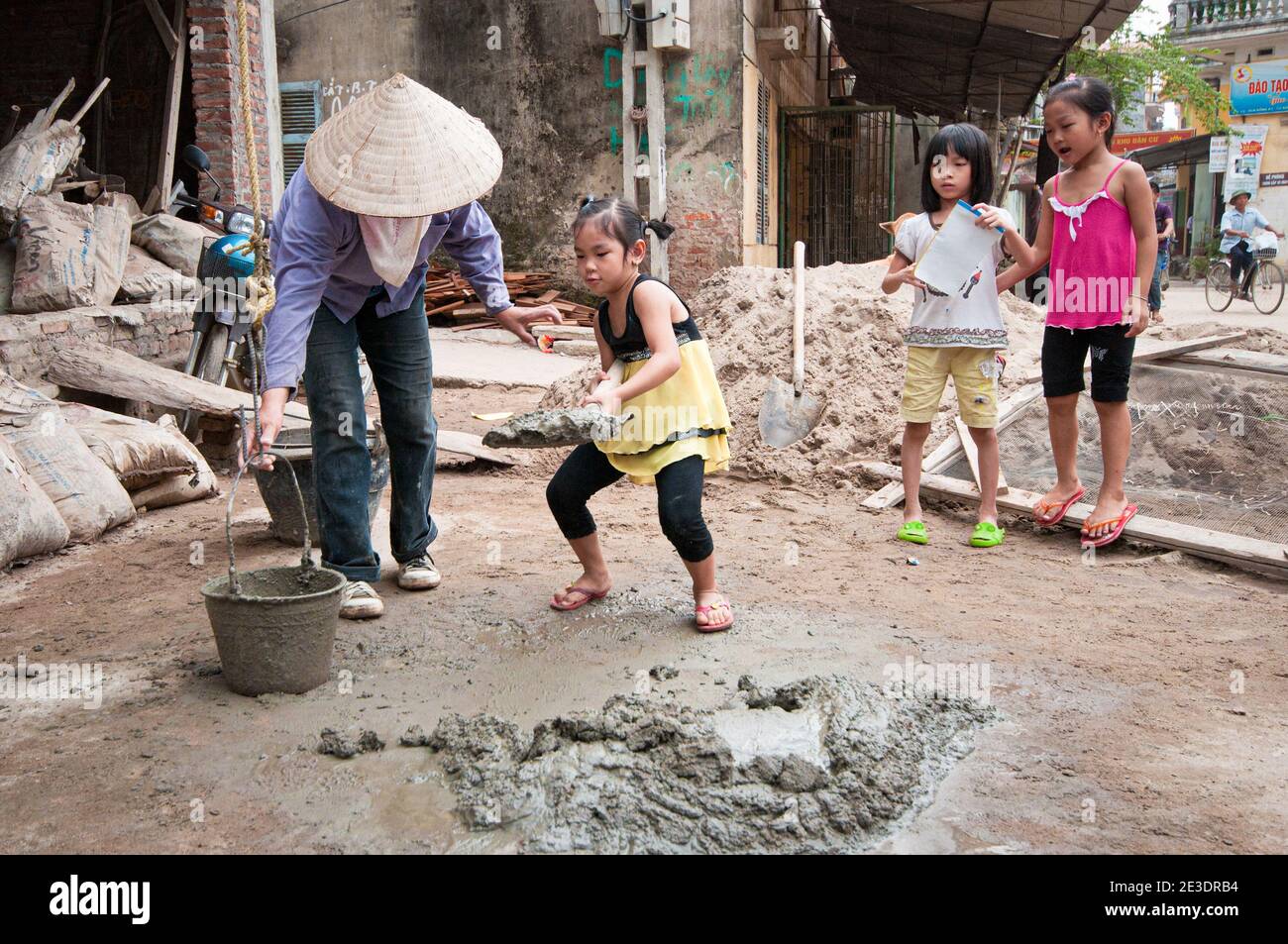 Young children helping mother doing building works. Working activities ...