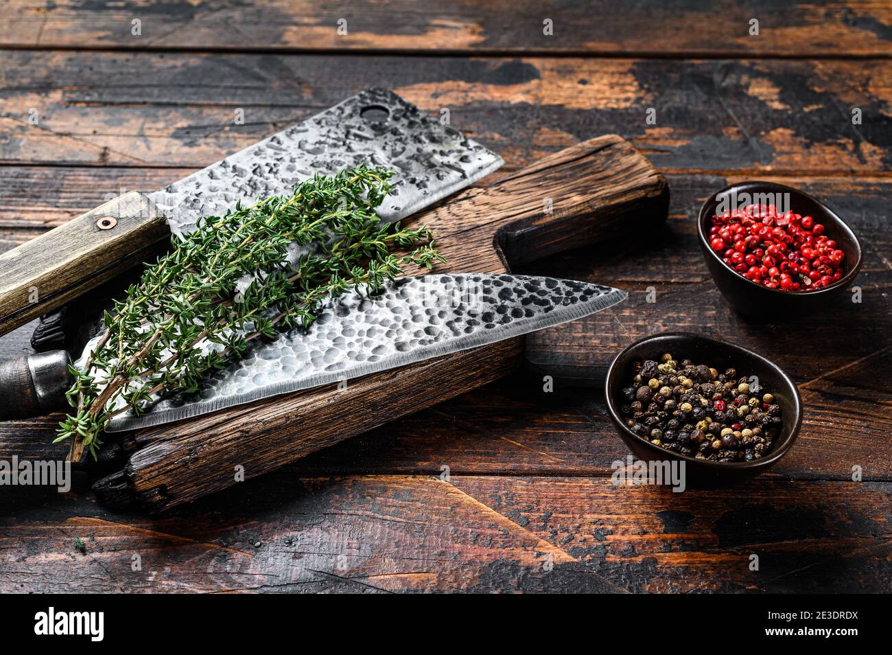 Old butcher meat cleaver and knife. Dark wooden background. Top view ...
