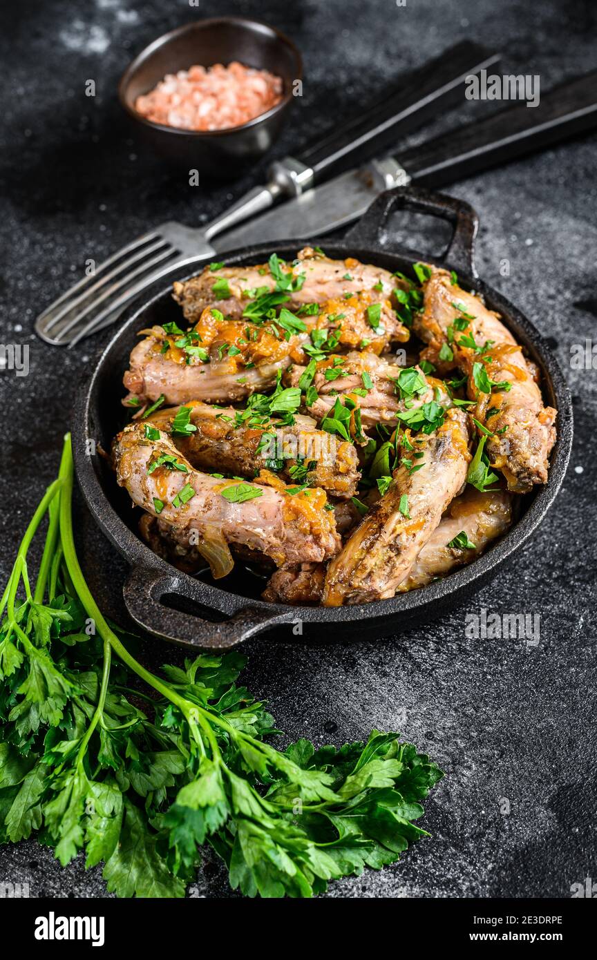 Stew with Chicken Neck meat and vegetables. Black background. Top view ...