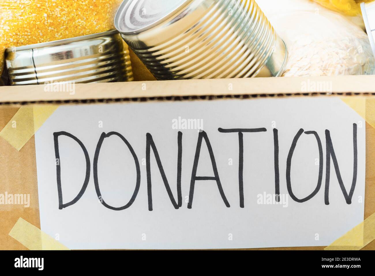 Open empty donation box with food in kitchen. Help for people. Charity ...