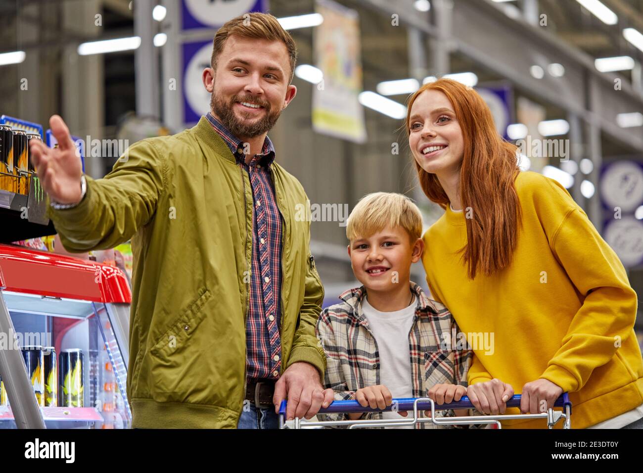 family with child boy in grocery store, family in shop. Parent and ...