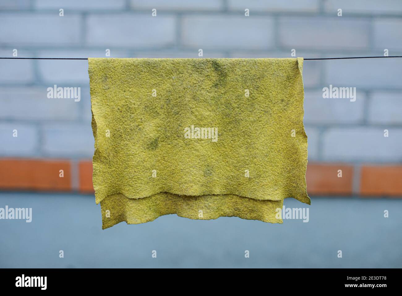 Dirty rag drying on a line Stock Photo - Alamy