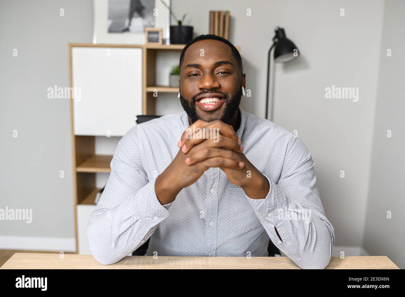 African-American guy is happy to accept the job Stock Photo - Alamy