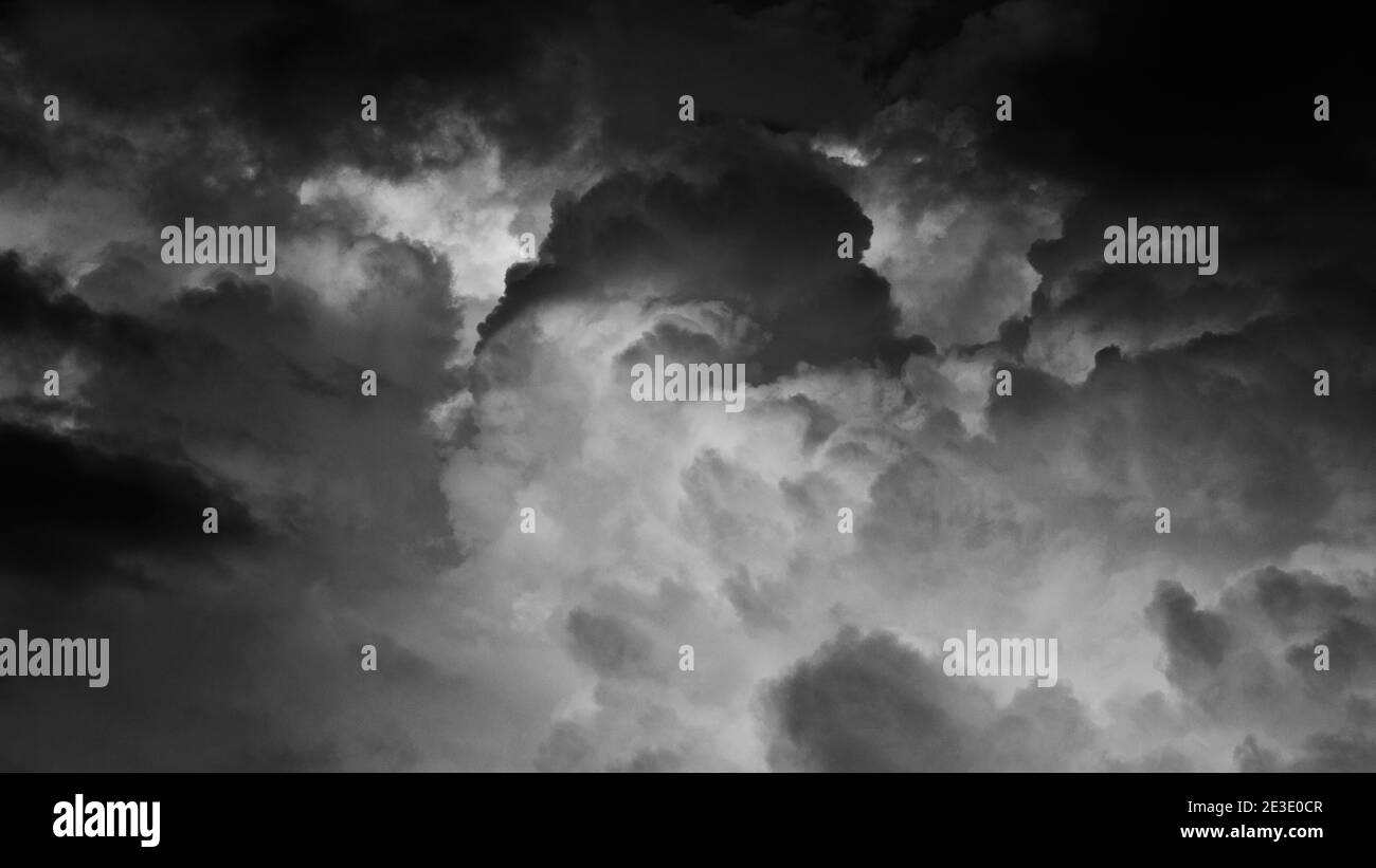 black and white clouds on a dark sky Stock Photo - Alamy
