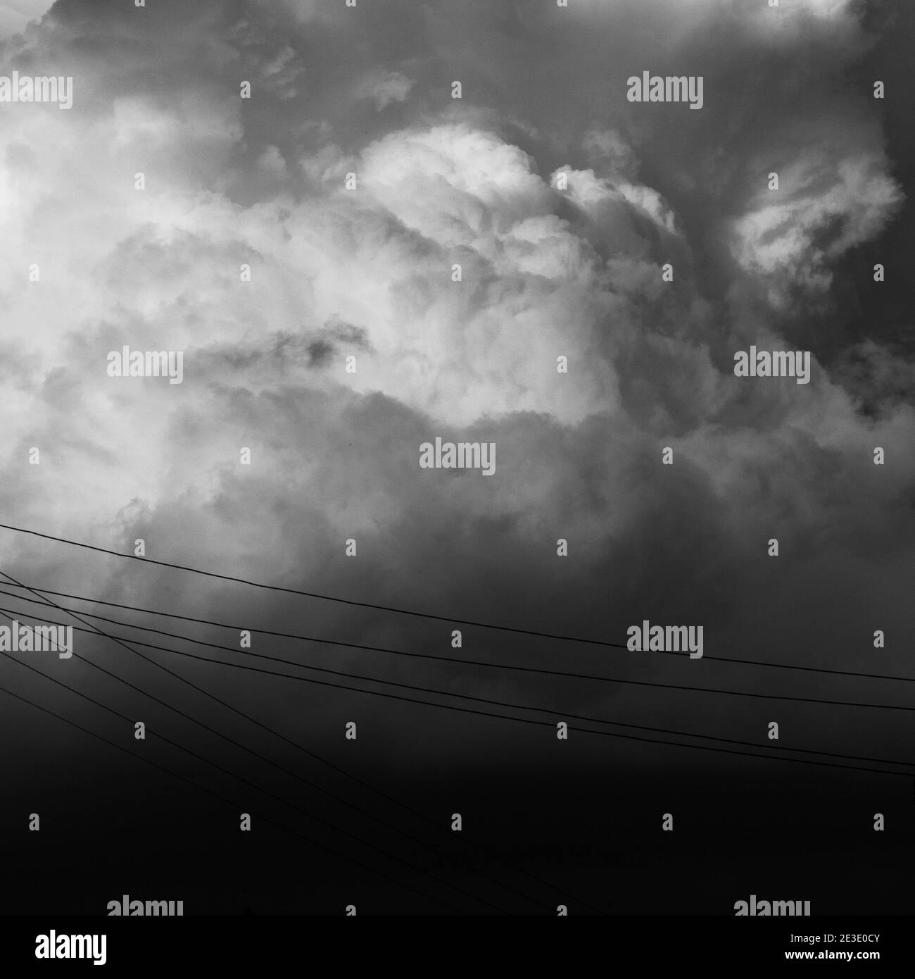 black and white clouds on a dark sky Stock Photo - Alamy