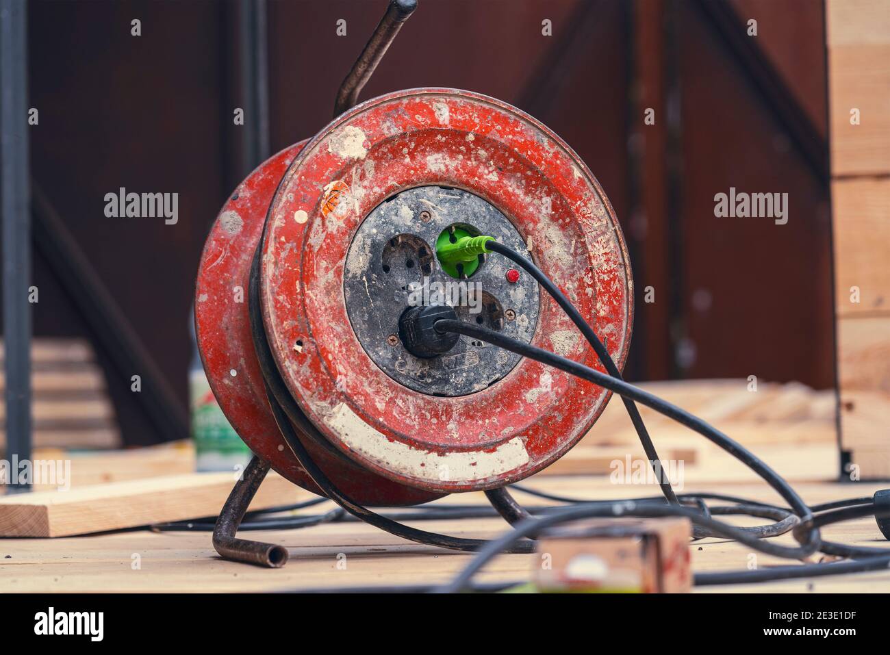 close up of an old, dirty, red cable reel Stock Photo - Alamy