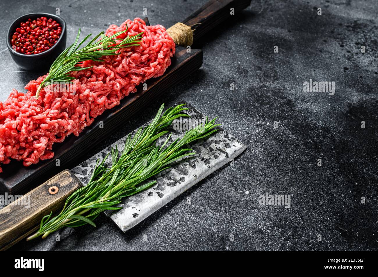 Fresh Raw mince beef, ground meat with herbs and spices. Black ...
