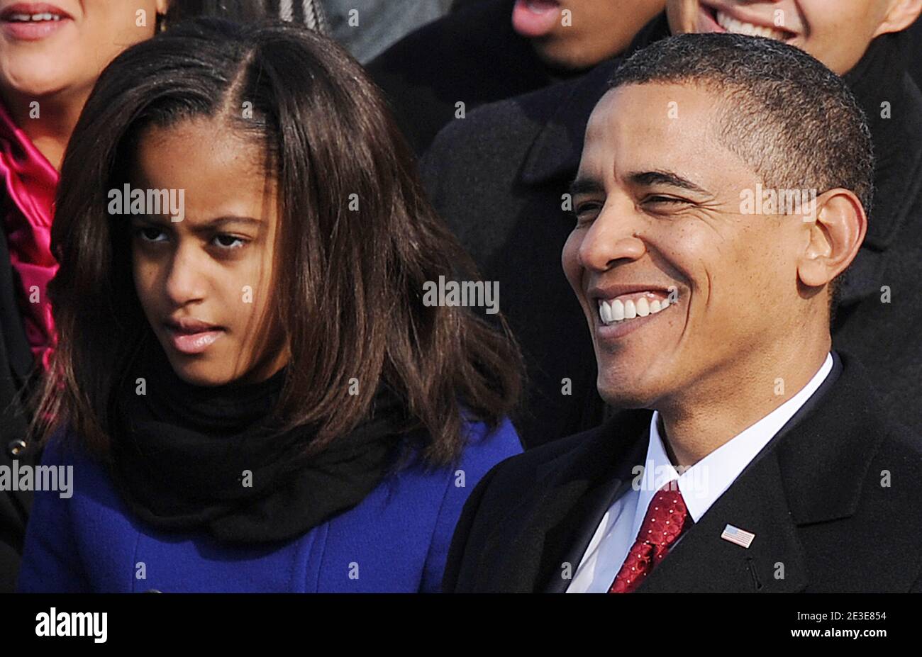U.S. President Barack Obama sits along with daughter Sasha after taking ...