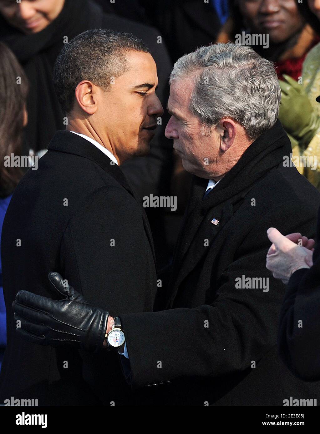 U.S. President Barack Obama hugs outgoing president George W. Bush ...