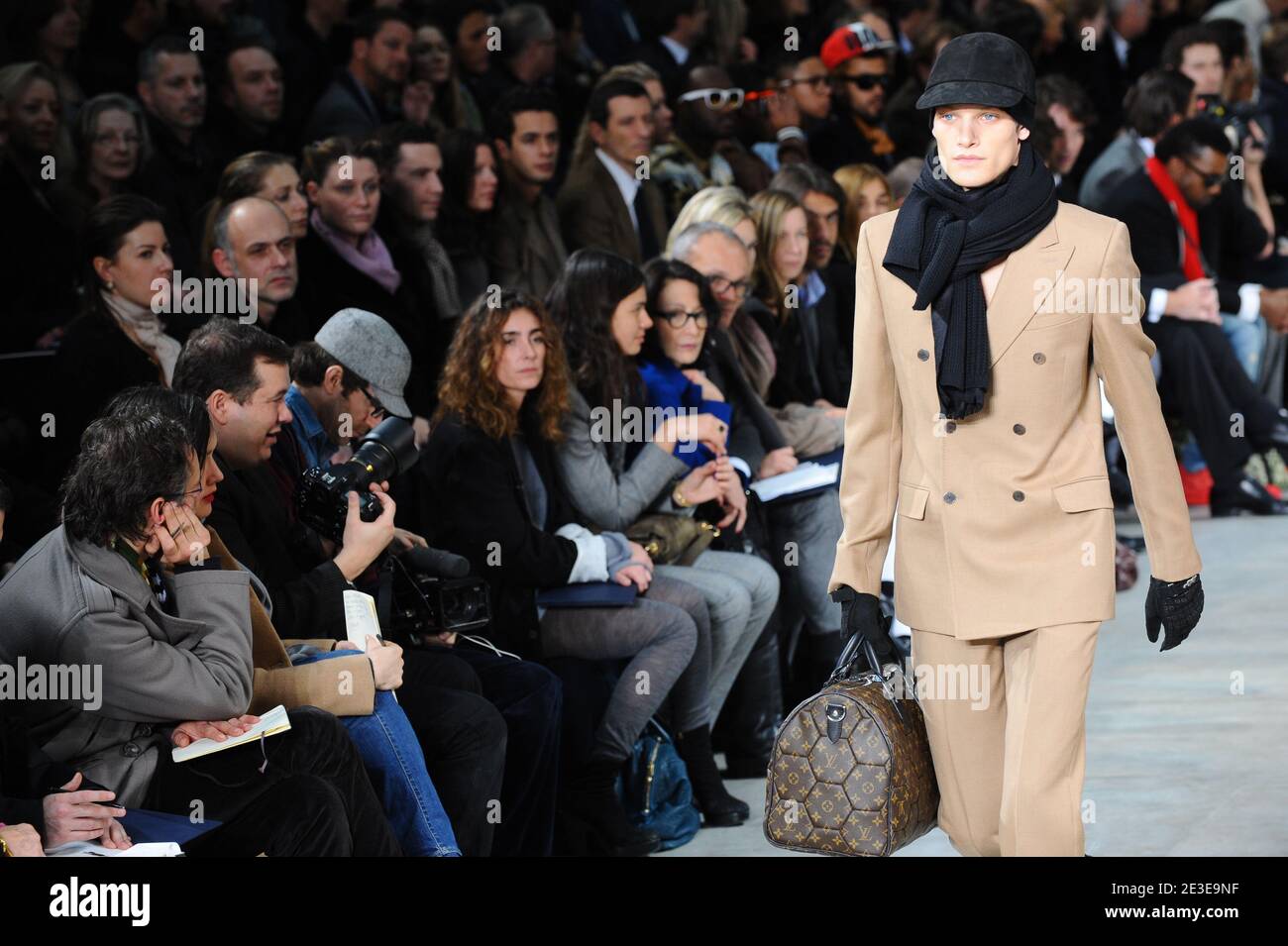 A model displays a creation by designer Paul Helbers for Louis Vuitton ...