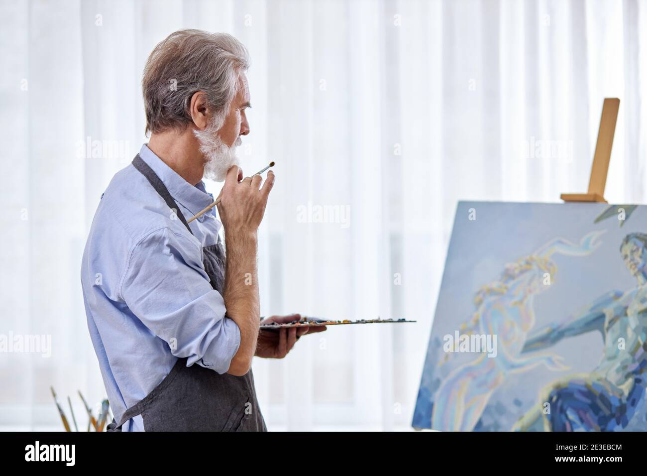 artist man looking at canvas his masterpiece, stand thinking, in ...