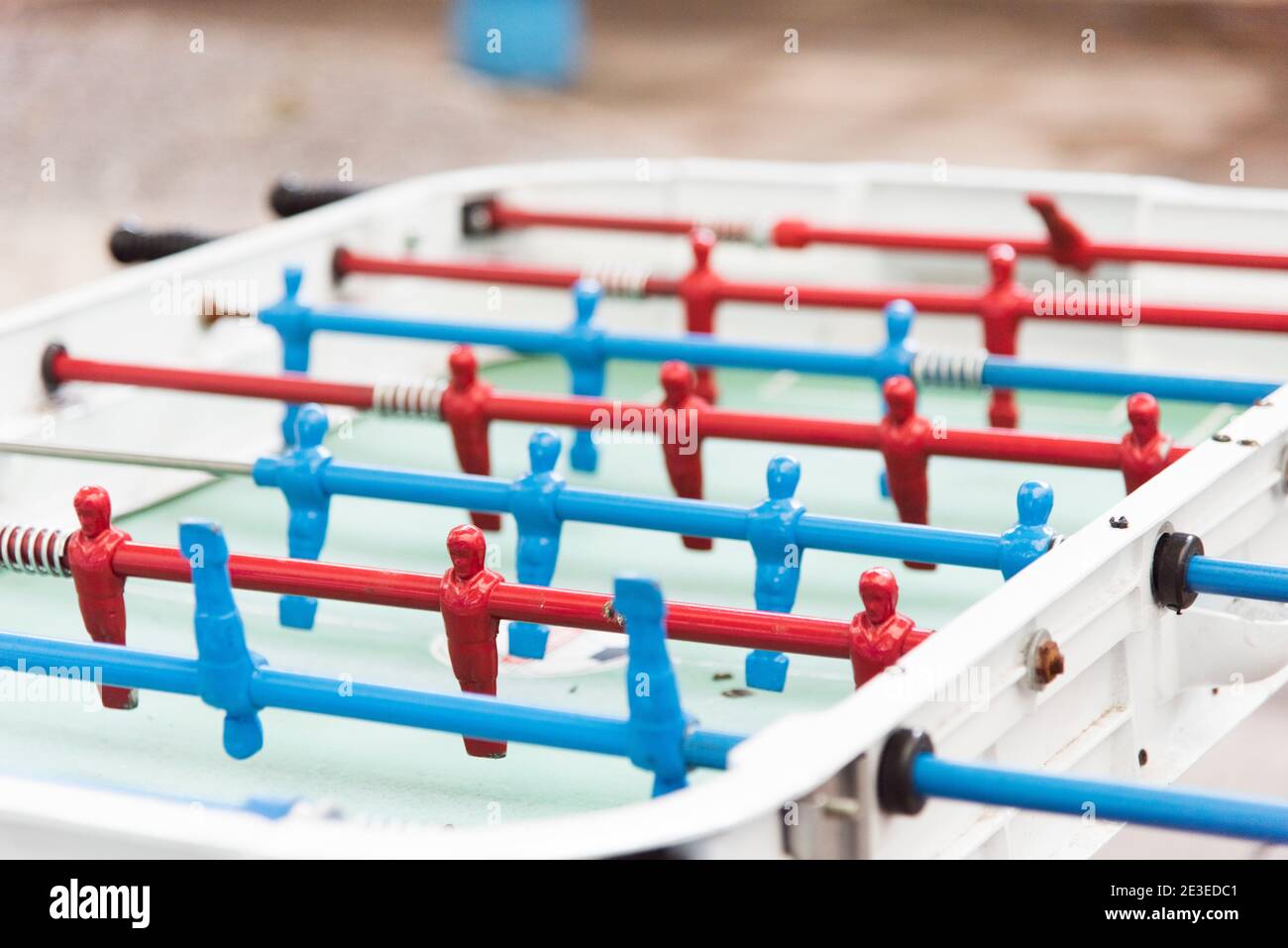 Detail of a white table soccer, foosball, with red and blue players ...