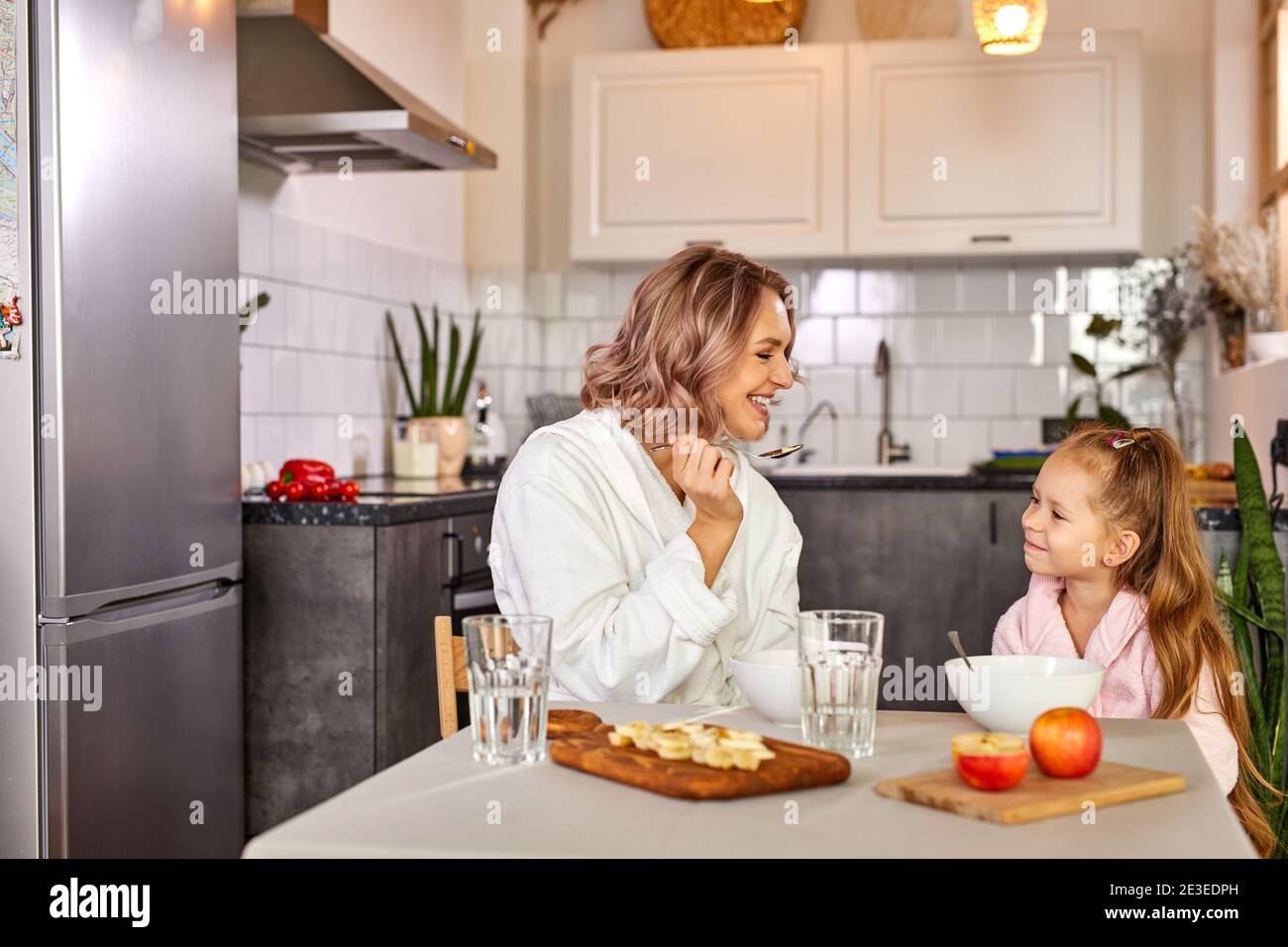 Family mother making breakfast children hi-res stock photography and ...