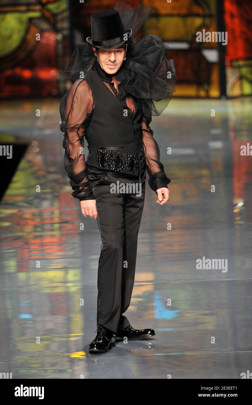 British designer John Galliano appears on the runway at the end of the ...