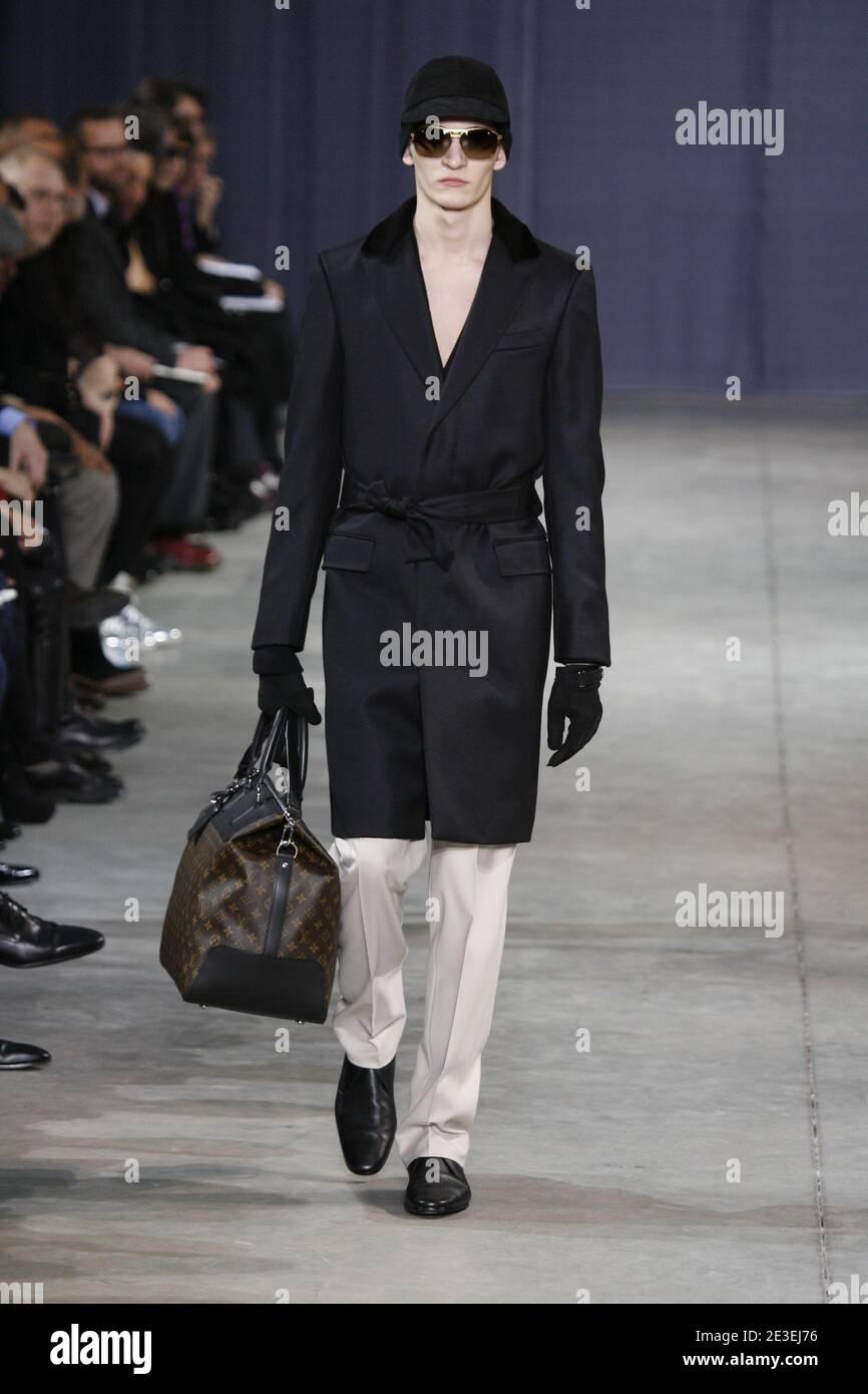 A model displays a creation by designer Paul Helbers for Louis Vuitton ...