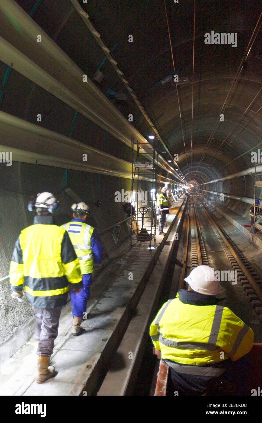 Workers repair damages in the part of the Channel Tunnel known as ...